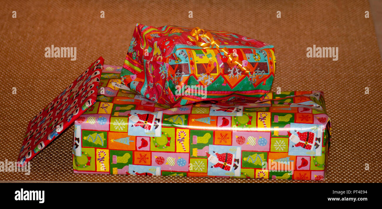 Christmas gifts in colorful packaging Stock Photo - Alamy