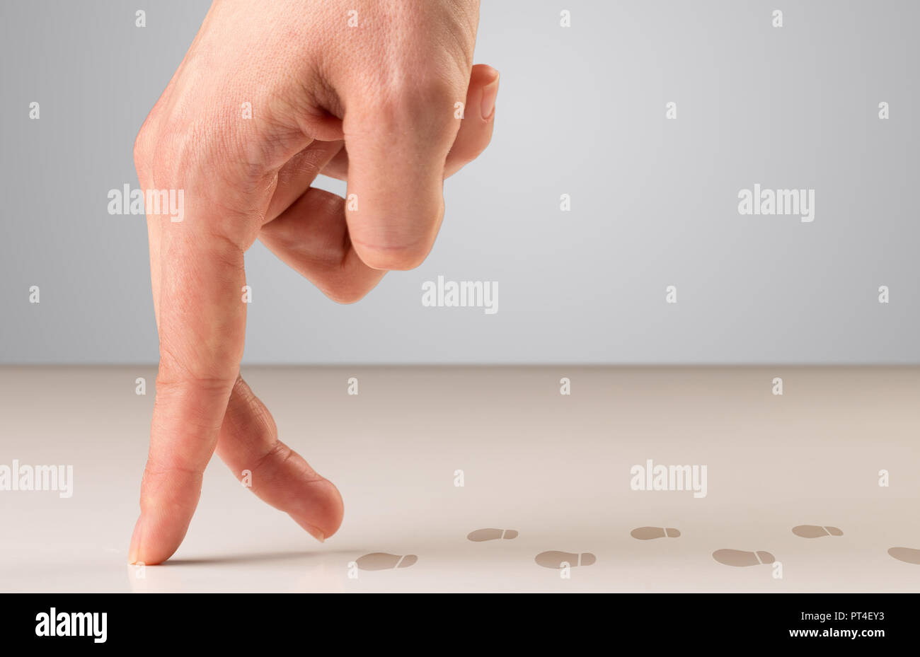 Female fingers walking with footsteps behind them Stock Photo - Alamy