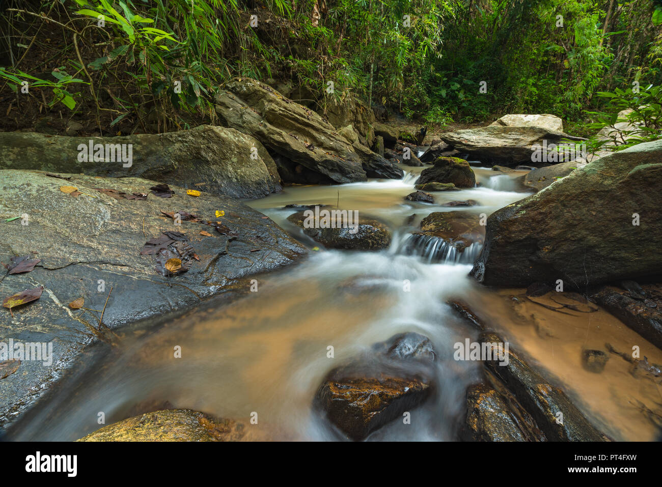 Water stream flow through the rock at Tard Mok waterfall of Chiang Mai ...