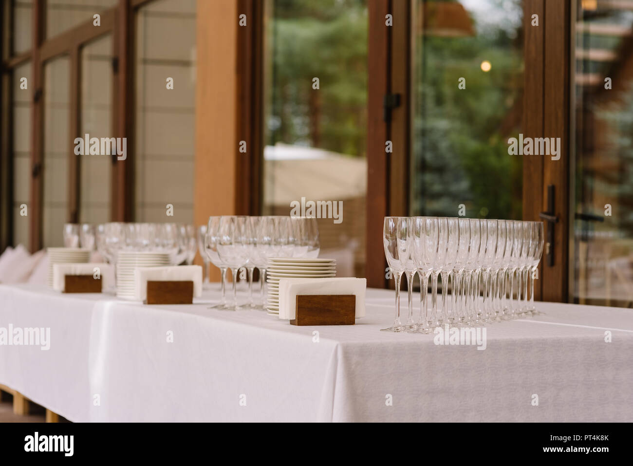 Table with ware for a buffet reception on a terrace of restaurant. Much ...