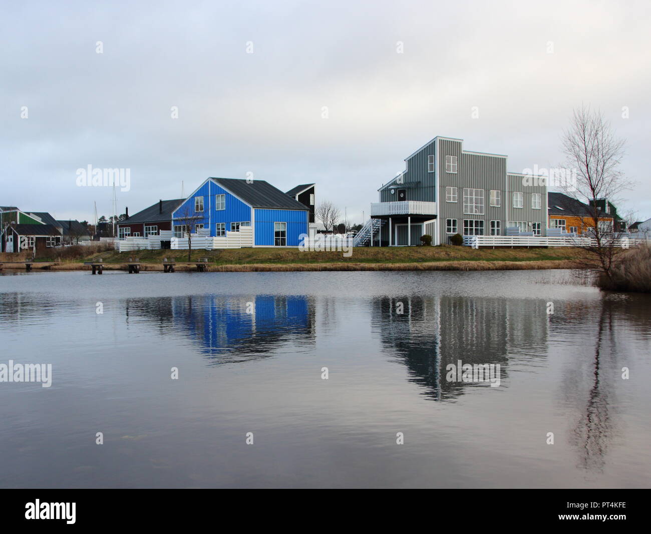 Colorful Houses with Water Reflection and Tree in Denmark. Blue and ...