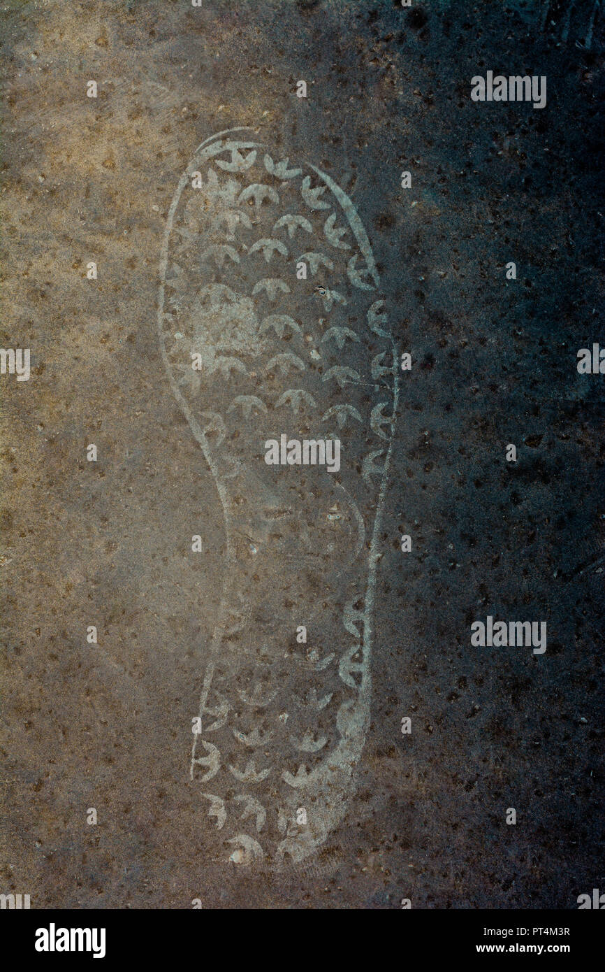 Footstep pattern seen on a concrete background Stock Photo - Alamy