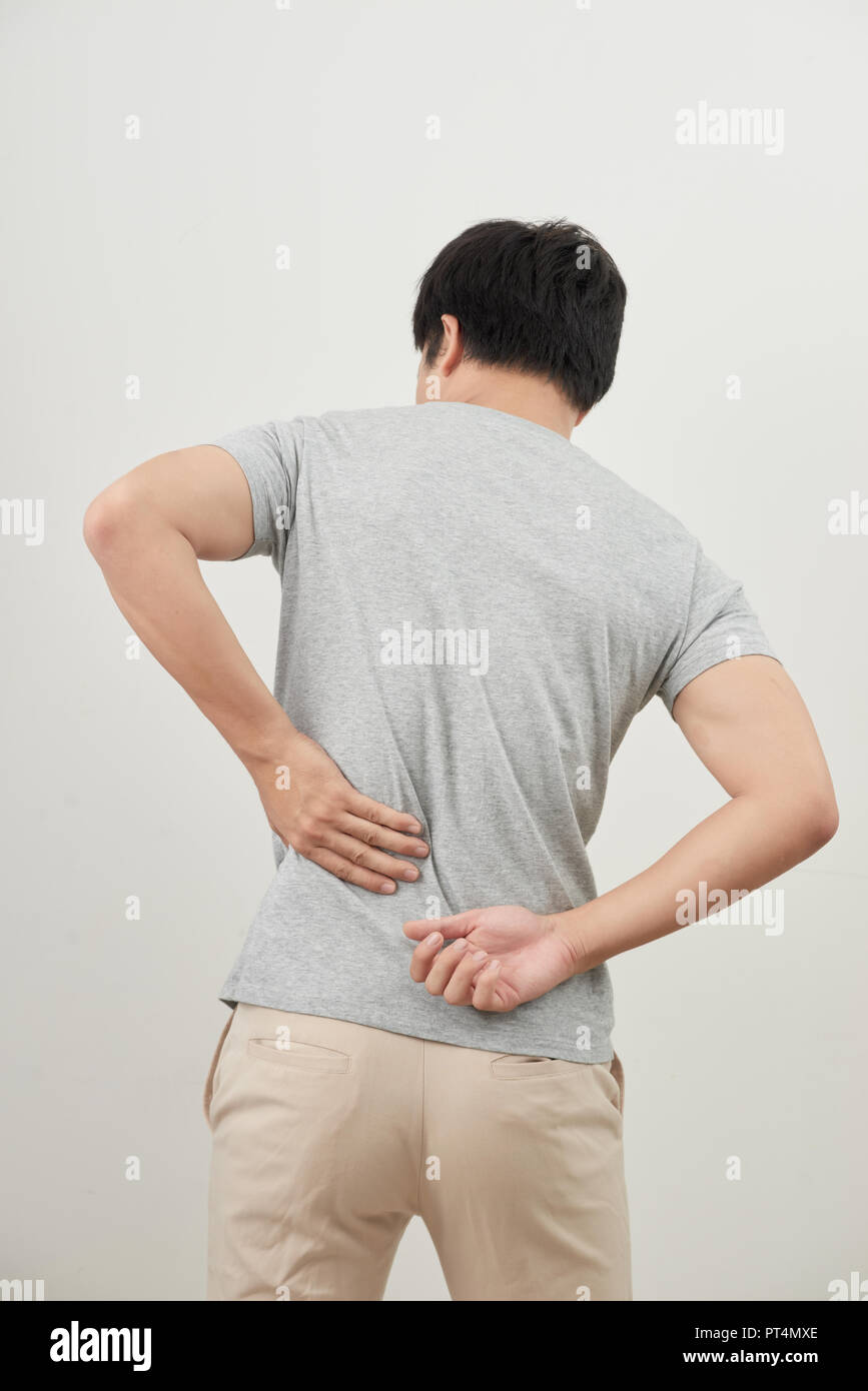Man with back pain isolated on white background Stock Photo - Alamy