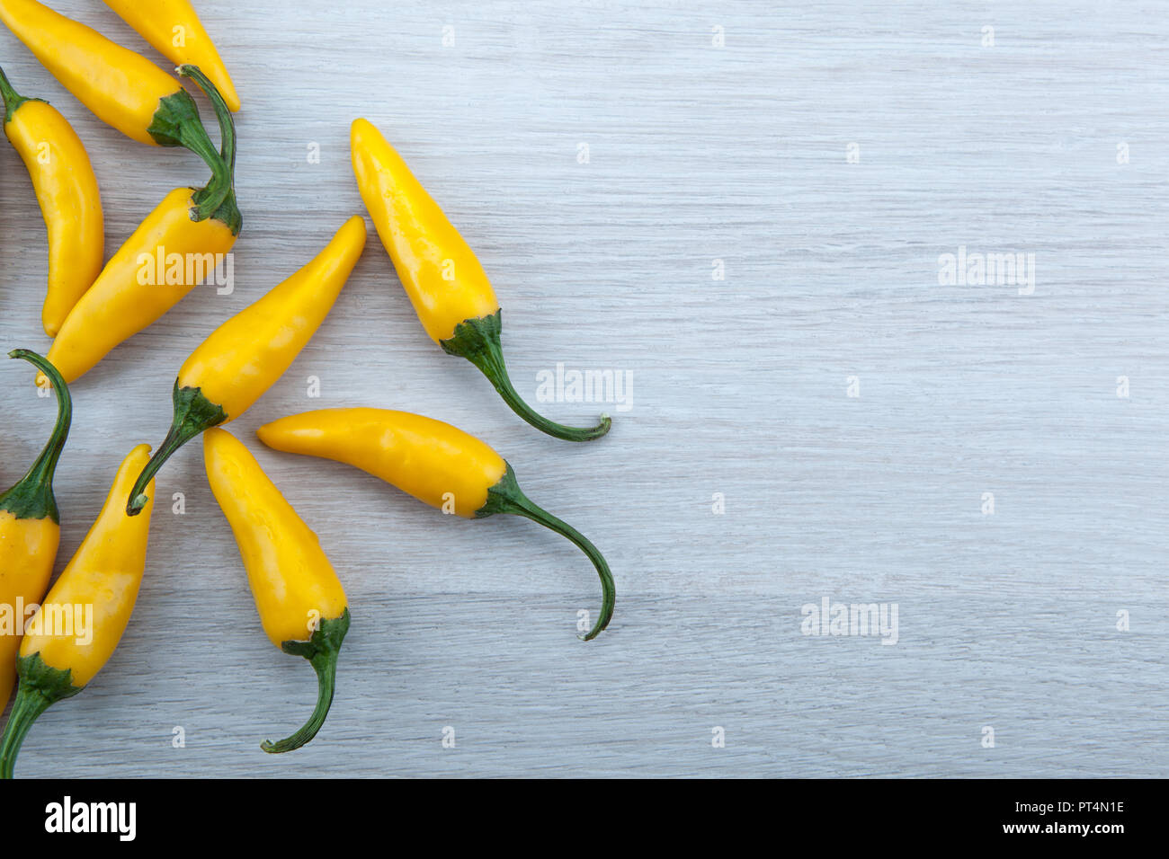 fruits of yellow fresh chilli pepper on gray background top view Stock ...