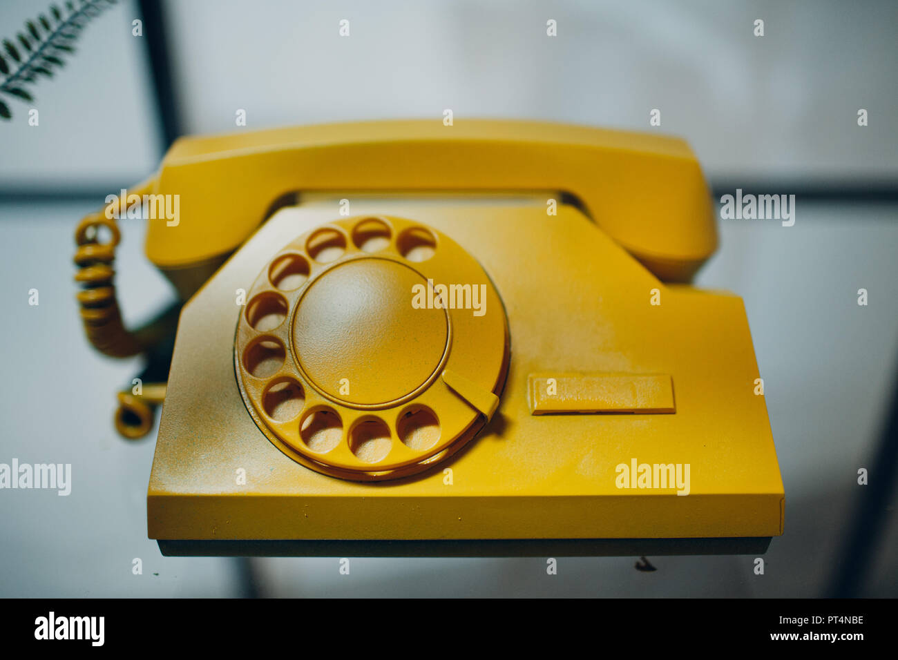 Old yellow phone Stock Photo - Alamy