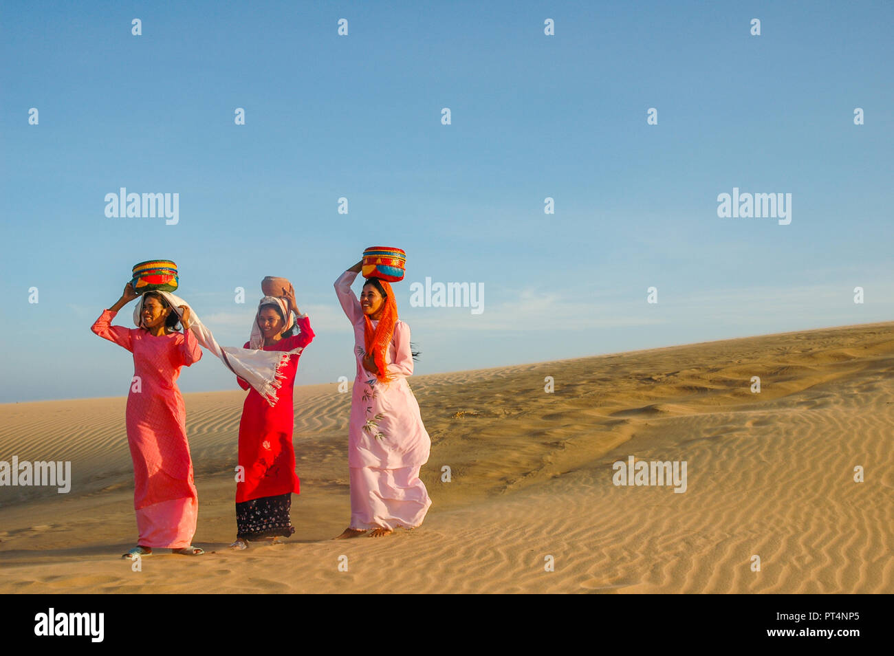 Phan Rang, Vietnam - October 1, 2005. Cham women in traditional dress ...