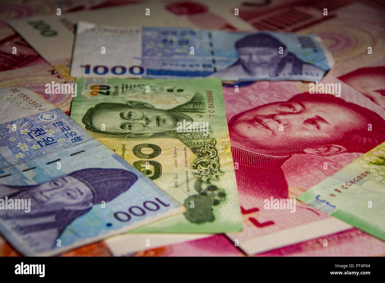 South Korean Won, Chinese RMB and Thai baht banknotes. Close up view ...