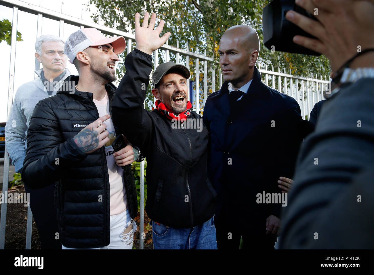 Manchester United fans with a life size cutout of Zinedine Zidane ...