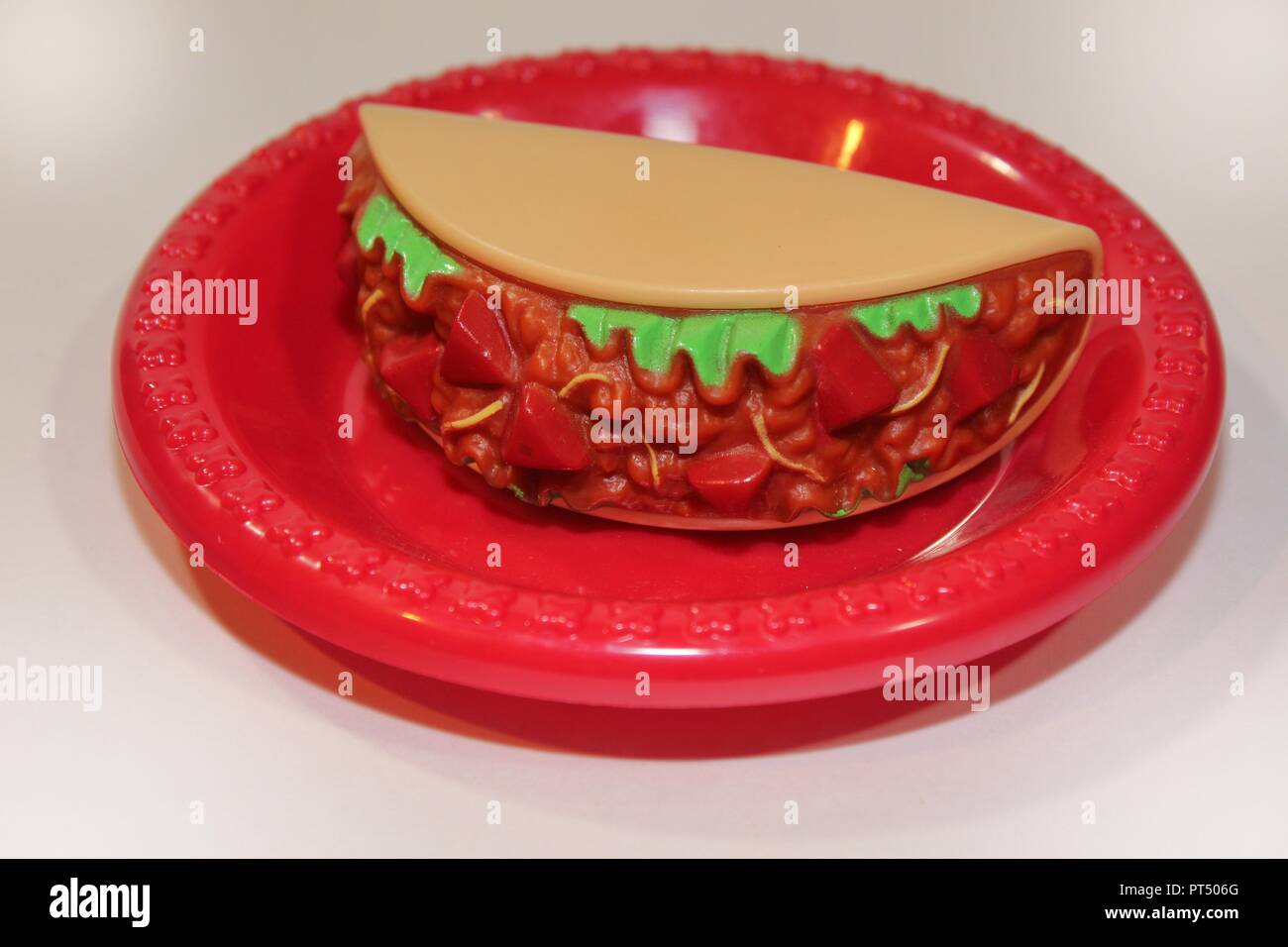 Children's Toy Food Taco with multiple toppings on a red plate Stock ...