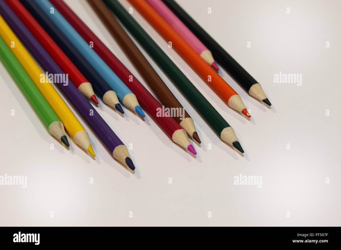 Colored Pencils Scattered in the left corner of the frame Stock Photo ...