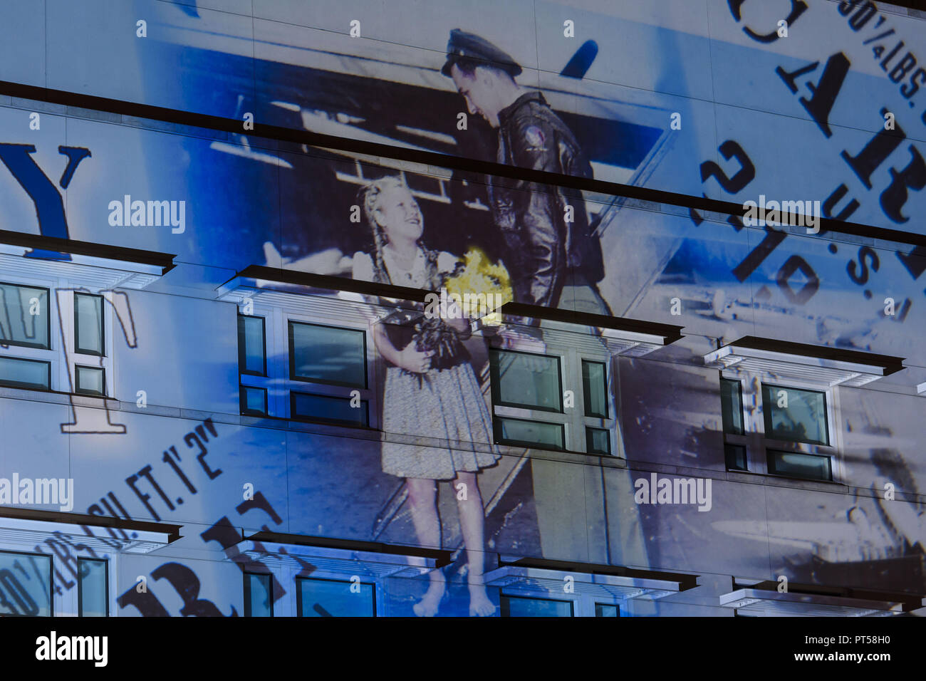 The illuminated external facade of the Embassy of the United States of ...