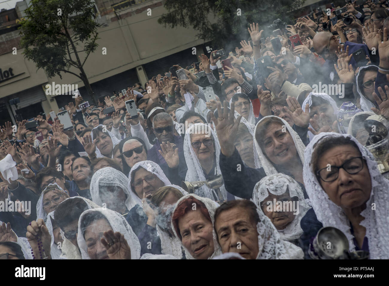 Lima, Peru. 6th Oct, 2018. Devotees participate in a procession of the ...