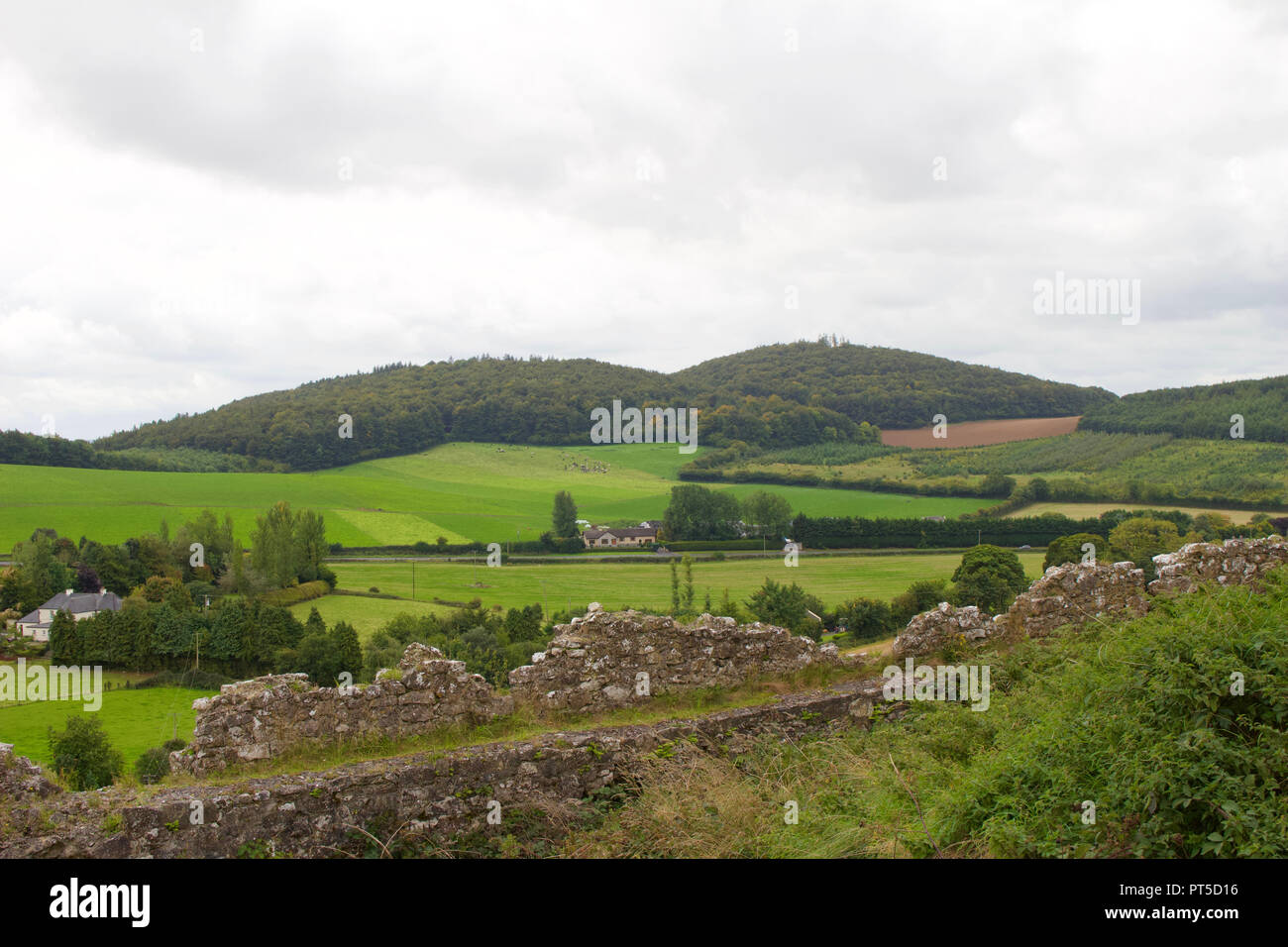 Modern Irish countryside landscape with ancient stone ruins in ...