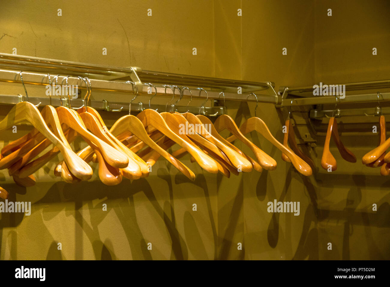 empty cloth hangers in room Stock Photo - Alamy