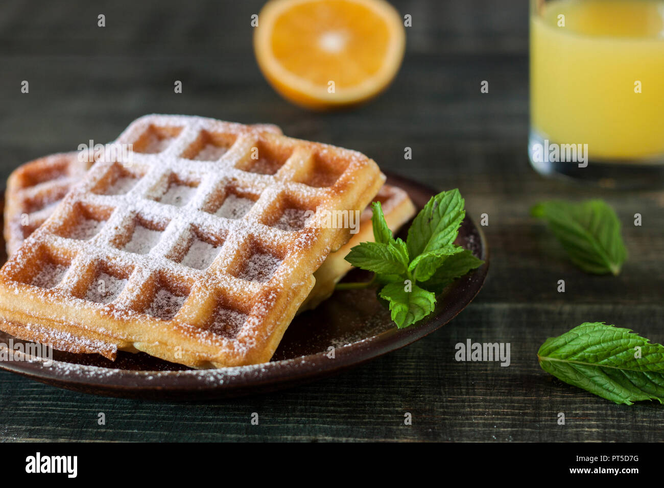 Viennese and Belgian waffles with honey Stock Photo - Alamy
