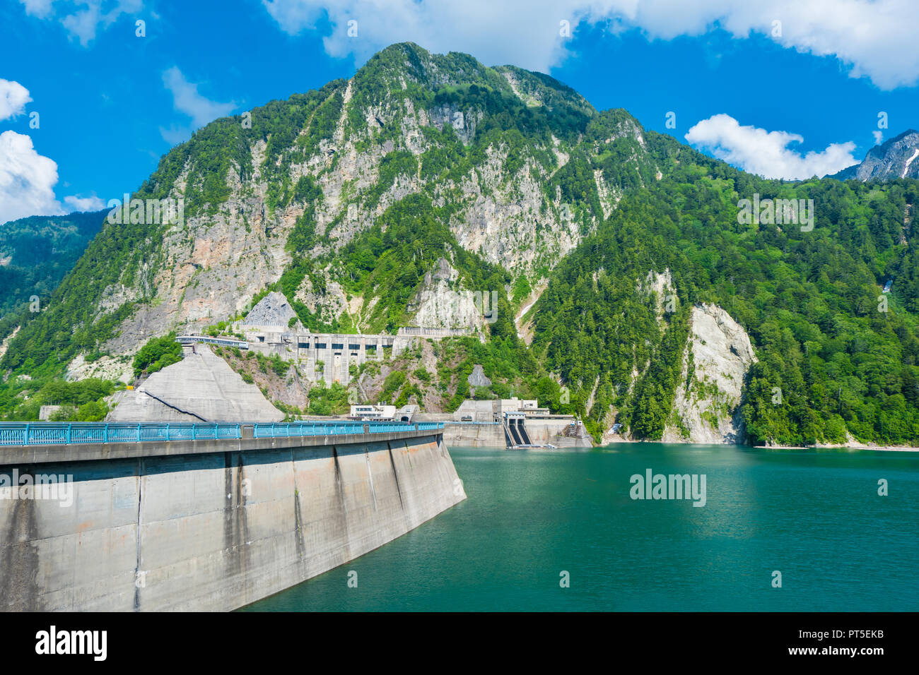 Beautiful scenery of Kurobe Dam on a brisk, with colorful lakeside ...