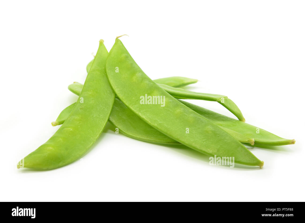 Pile of fresh snap peas isolated on a white background Stock Photo - Alamy
