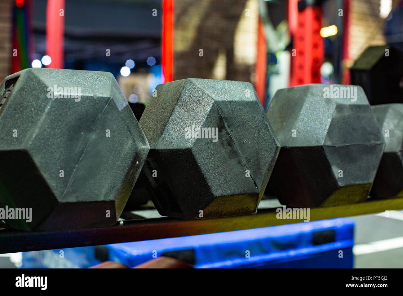 Black Rubber Dumbbells Hexagonal Heavy Duty Weight Set Used For Serious Hardcore Gym Workouts
