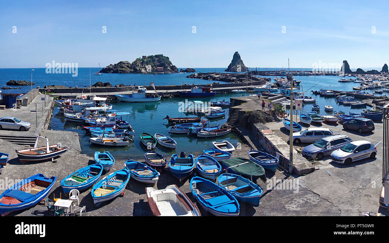 Harbour of fishing village Aci Trezza, behind the cyclops islands ...
