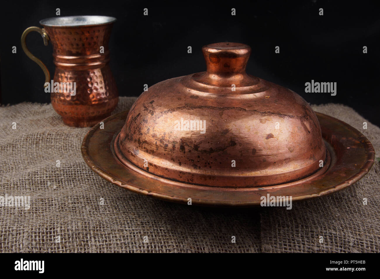 Turkish set of dishes from copper, glitters, standing on the table ...