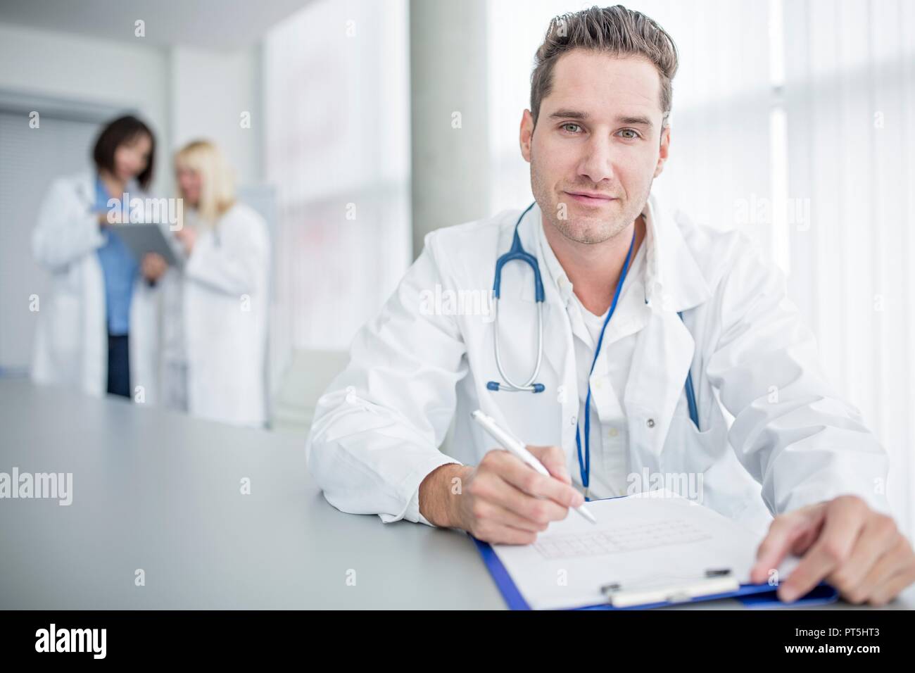 Doctor paperwork gp hi-res stock photography and images - Alamy
