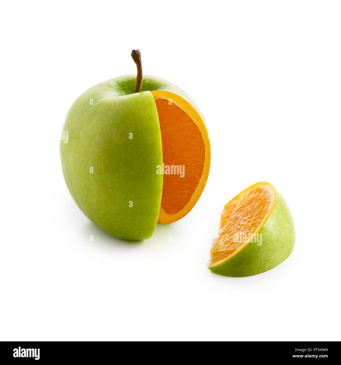 Segment cut from apple showing orange inside Stock Photo - Alamy