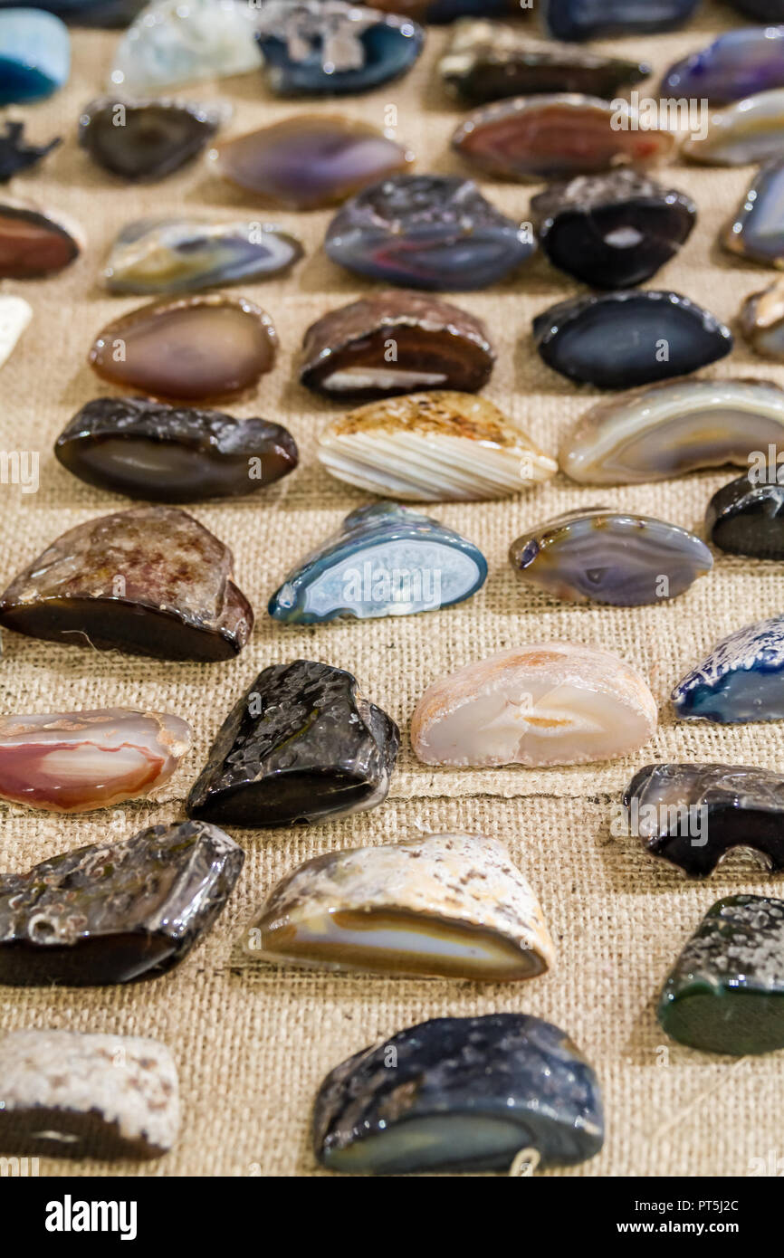 Colorful natural stones in gift shop Stock Photo - Alamy