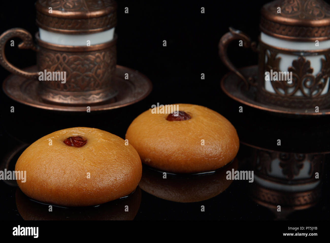 Turkish Shakerpare cake and cups with aromatic coffee on a dark ...