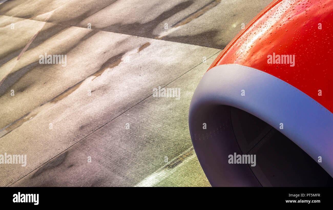 jet engine of the airplane with runaway tarmac as the background ...