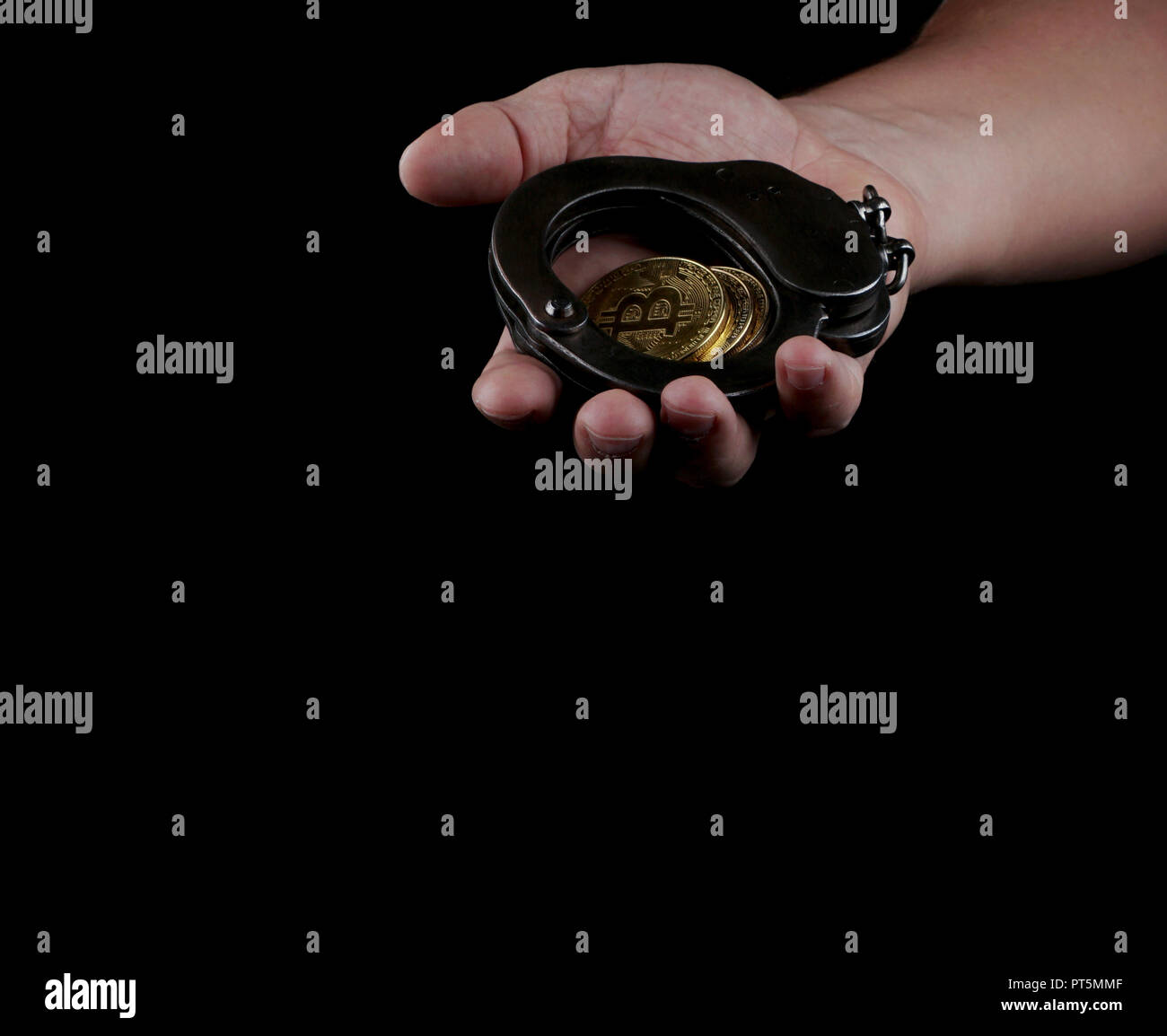 steel handcuffs of police special equipment, fetters on a black ...