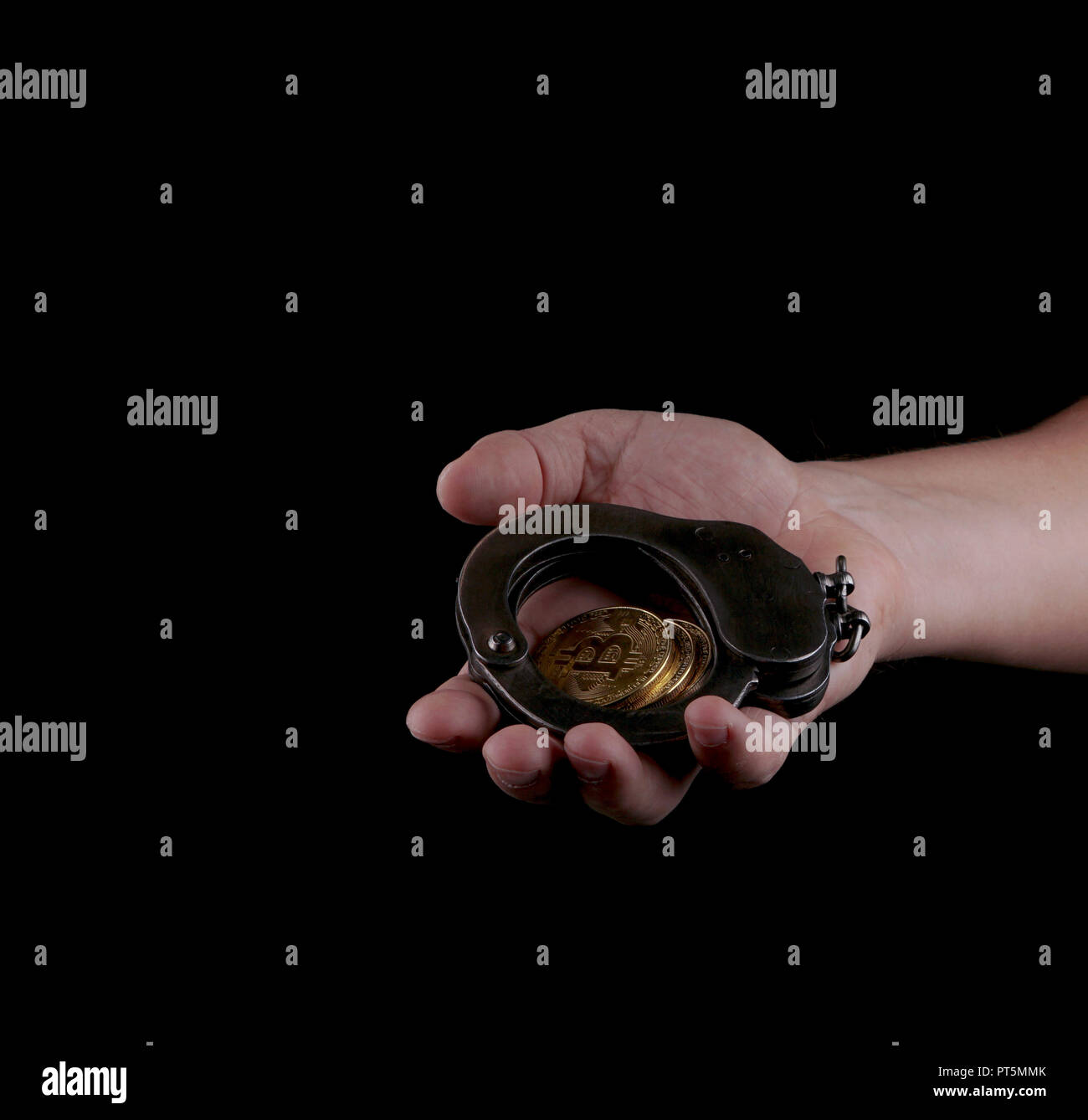 steel handcuffs of police special equipment, fetters on a black ...