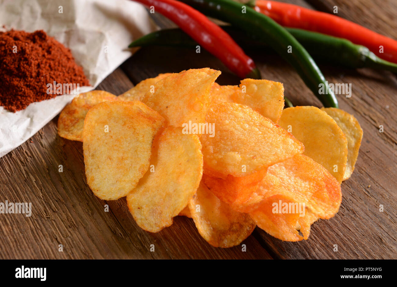 Potato chips with hot pepper spice Stock Photo - Alamy