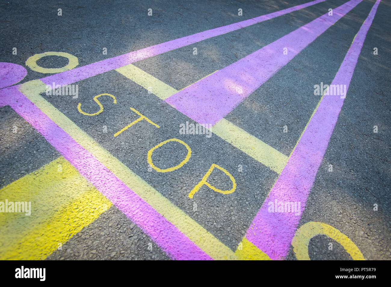 A stop sign marking race direction painted on paved road Stock Photo ...