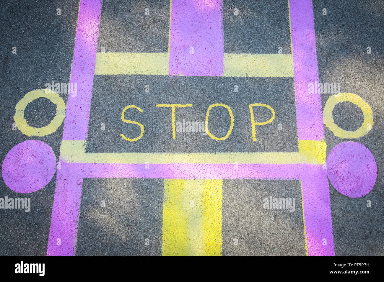 A stop sign marking race direction painted on paved road Stock Photo ...