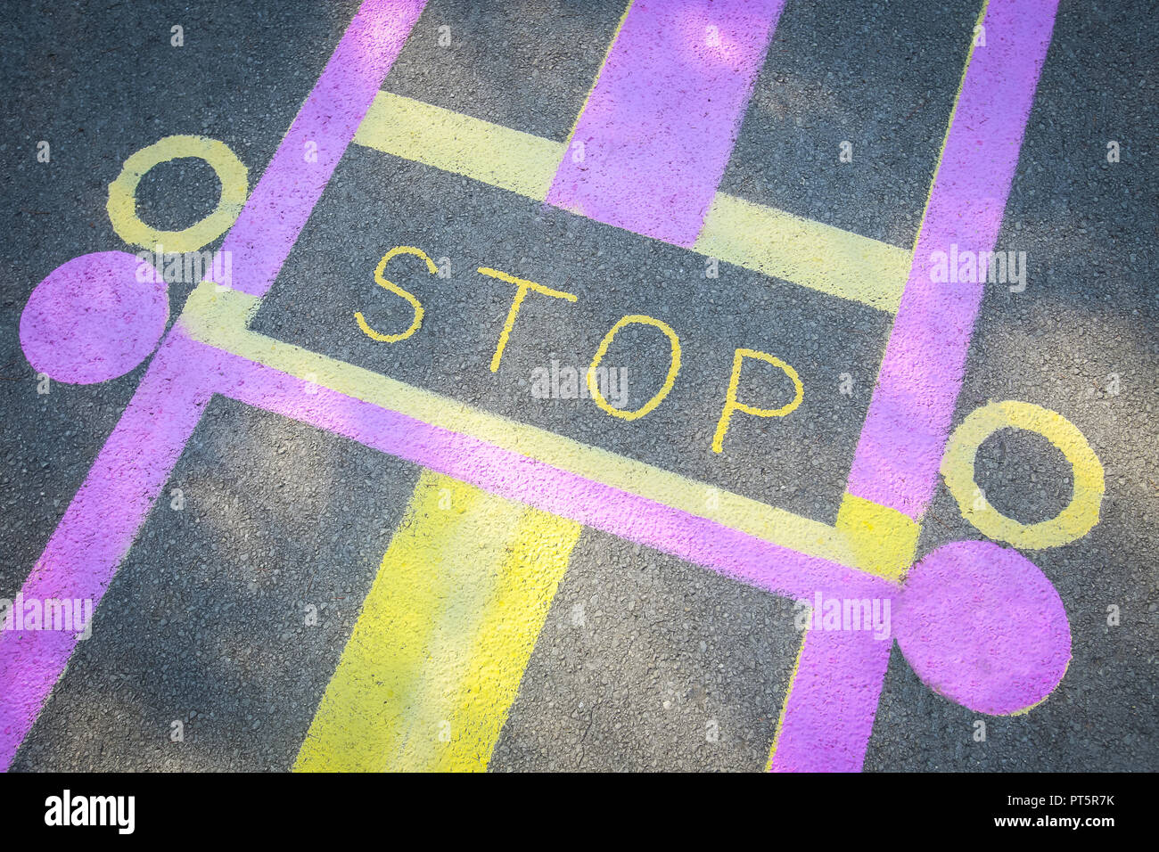 A stop sign marking race direction painted on paved road Stock Photo ...