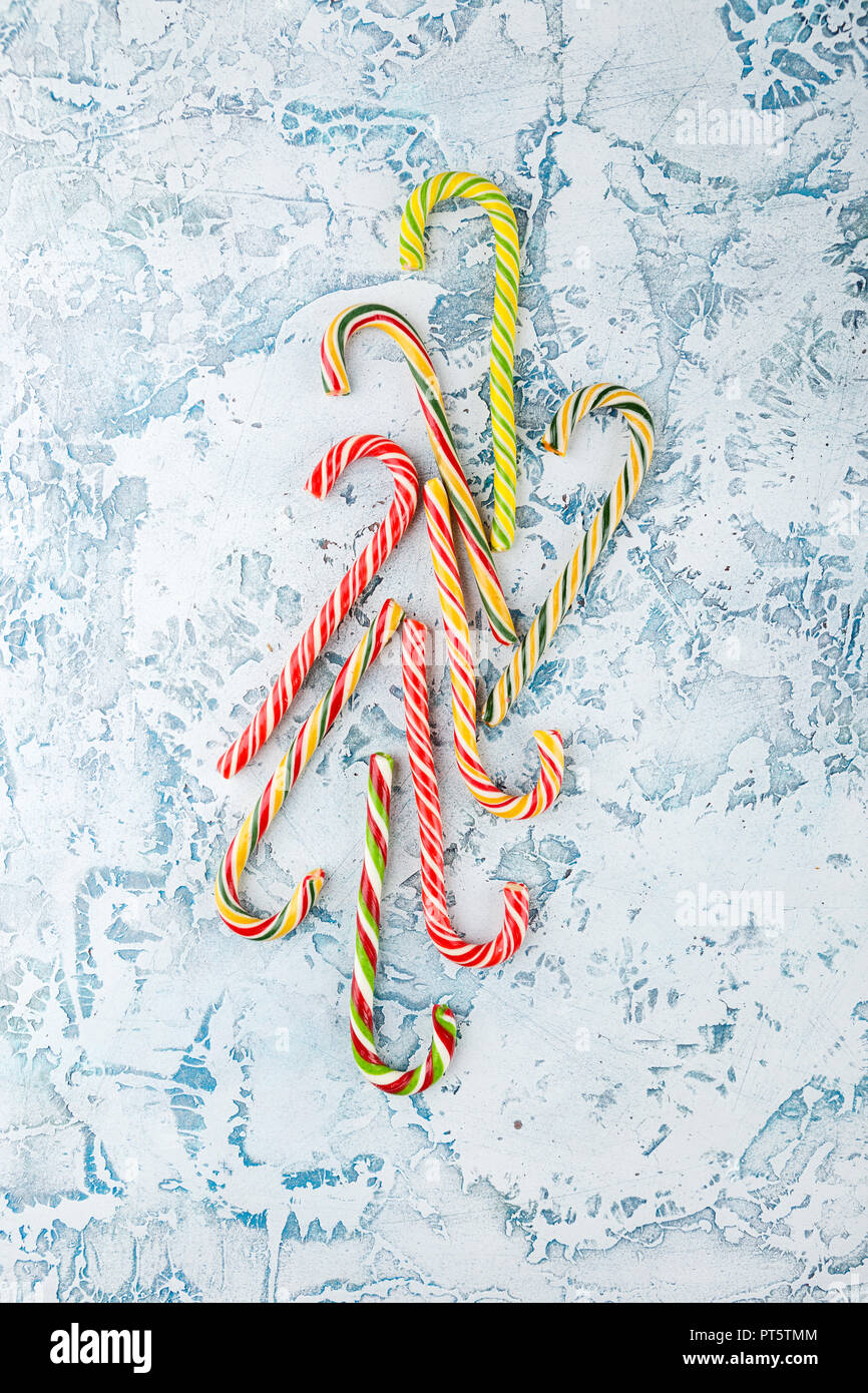 Christmas sweet candy canes on a light background Stock Photo - Alamy