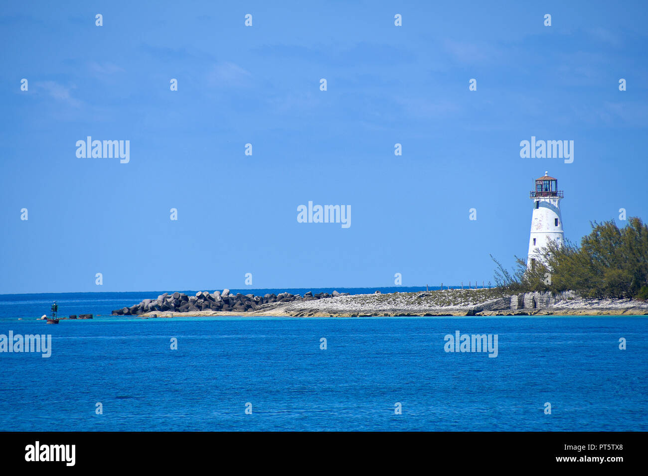 white lighthouse at entrance of Paradise Island Harbor in Nassau ...