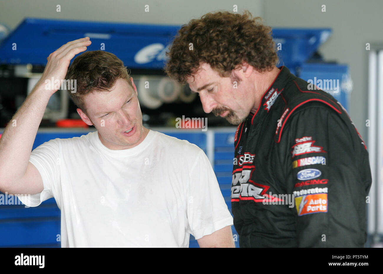 Dale Earnhardt Jr. (L) talks to Boris Said in the garage during NASCAR ...
