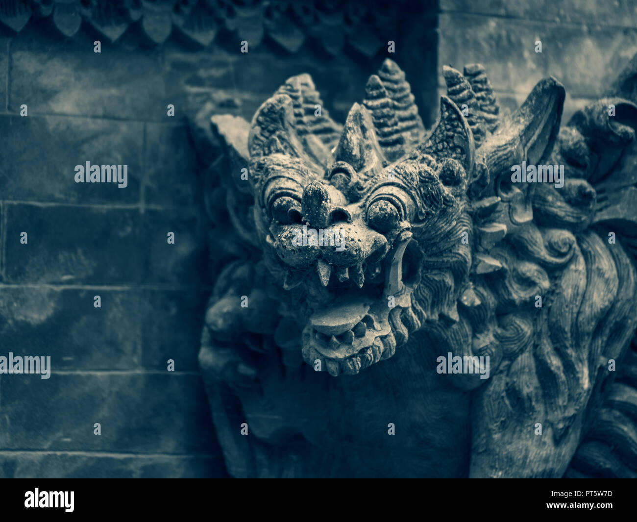 Traditional stone statues depicting demons, gods and Balinese ...