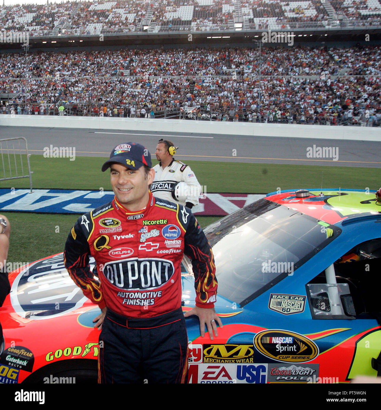 Jeff Gordon waits by his car just prior to the NASCAR Sprint Cup Coke ...