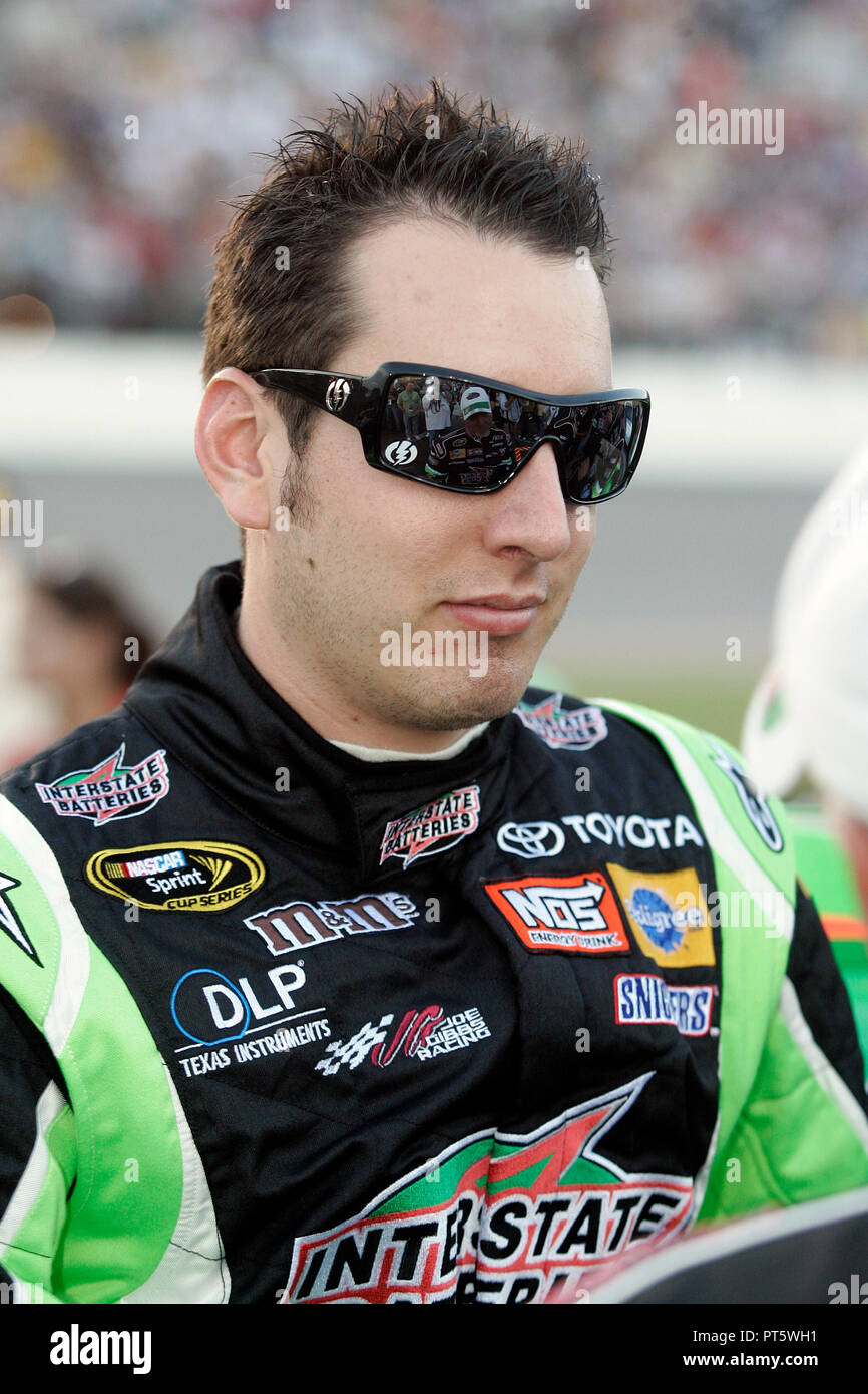Kyle Busch waits by his car just prior to the NASCAR Sprint Cup Coke ...