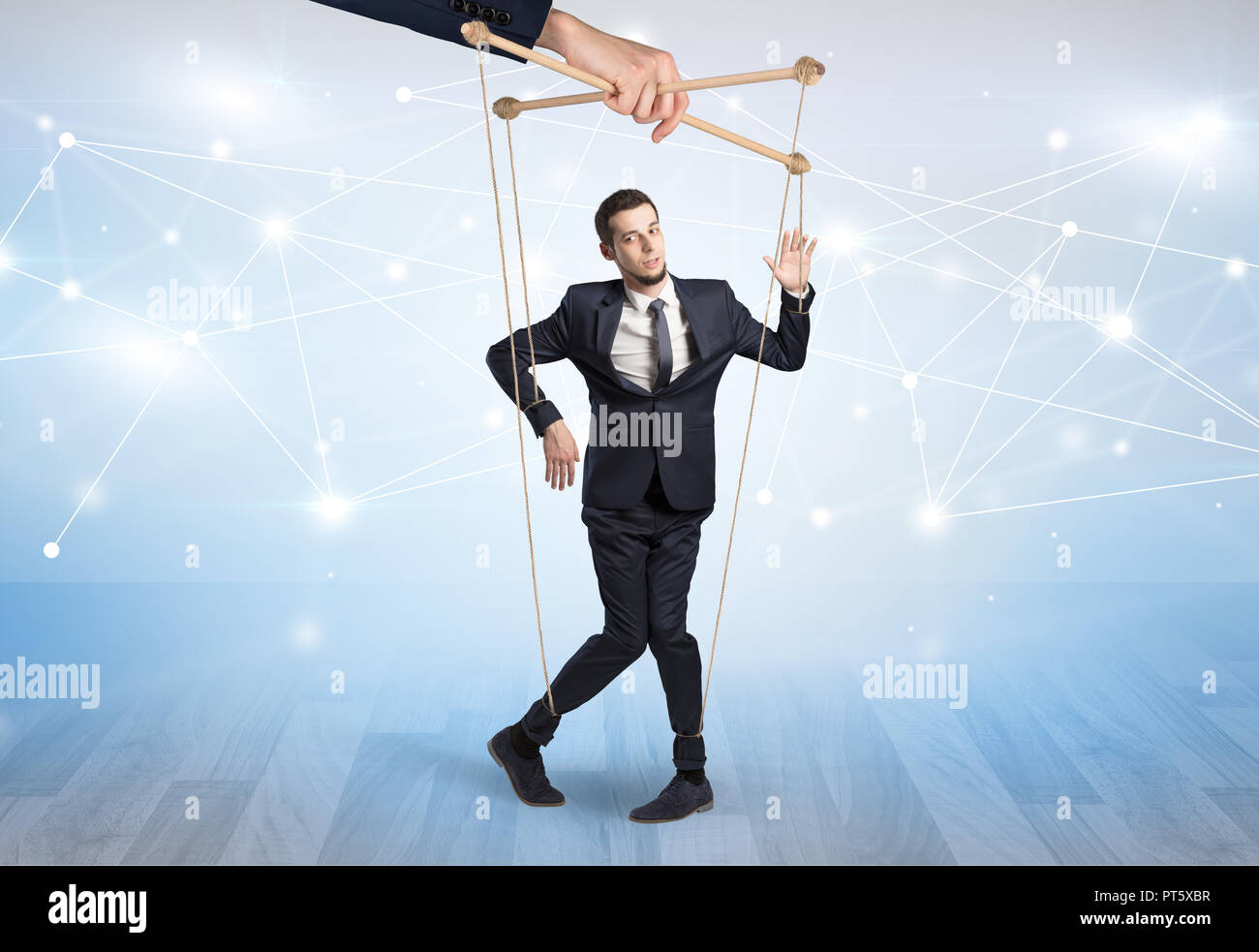 Puppet businessman controlled by another hand with financial concept ...