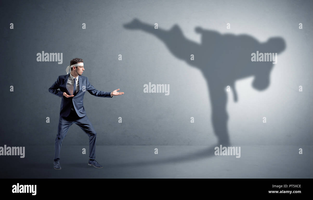 Young karate man confronting with his own shadow Stock Photo - Alamy