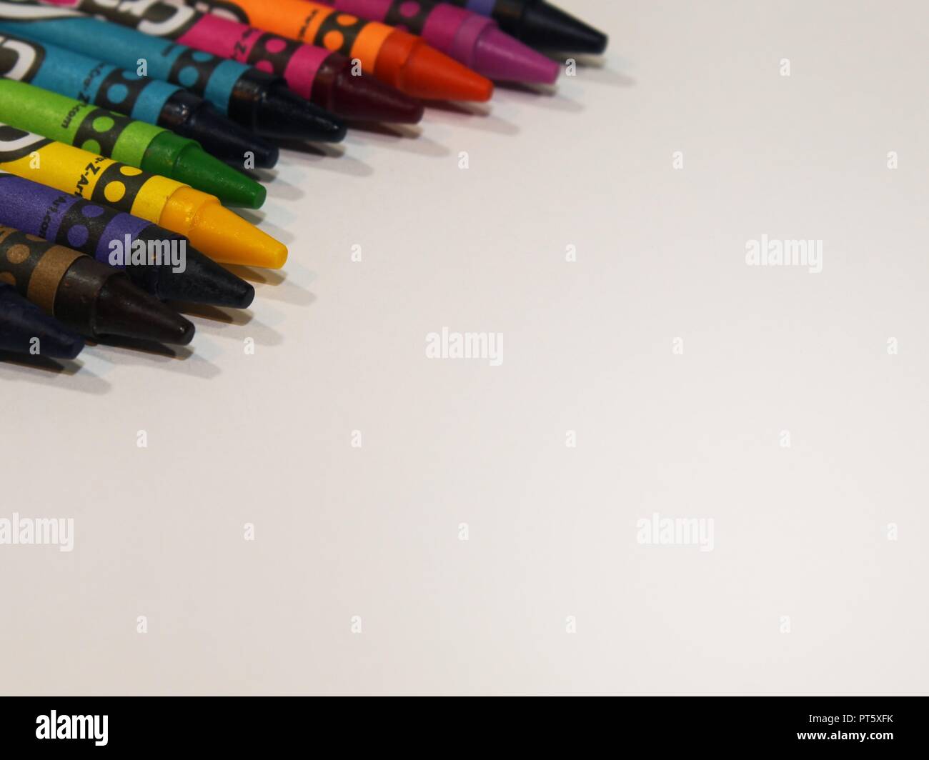 Multiple Crayons lined up together in the Upper Left Corner of the ...