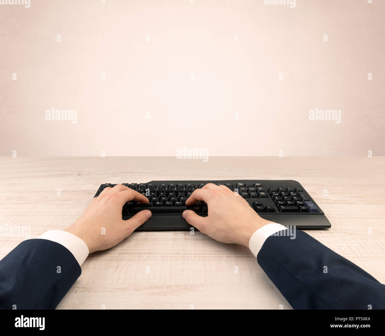 First person view of an elegant businessman hand typing on light ...