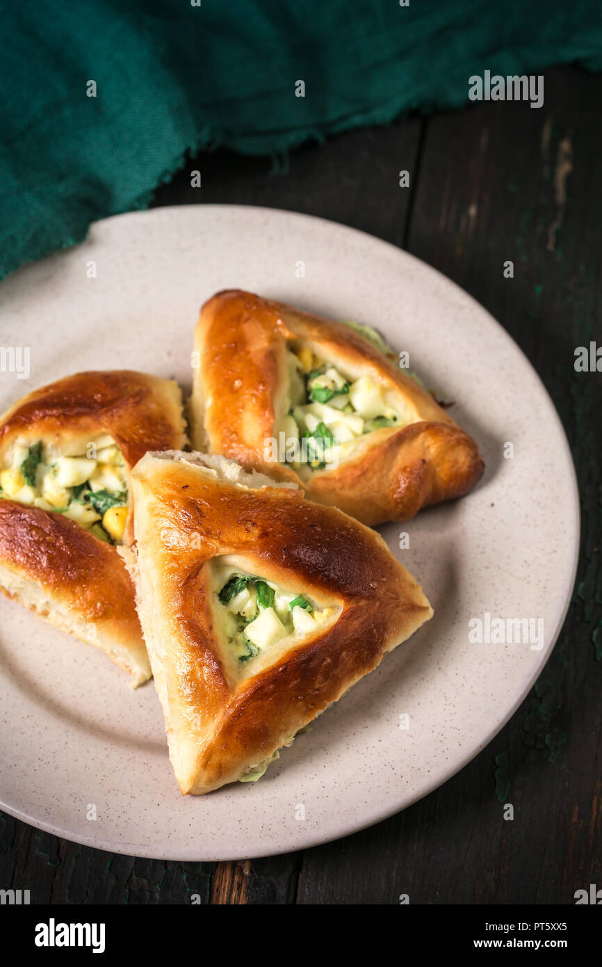 triangle pie with egg, top view Stock Photo - Alamy