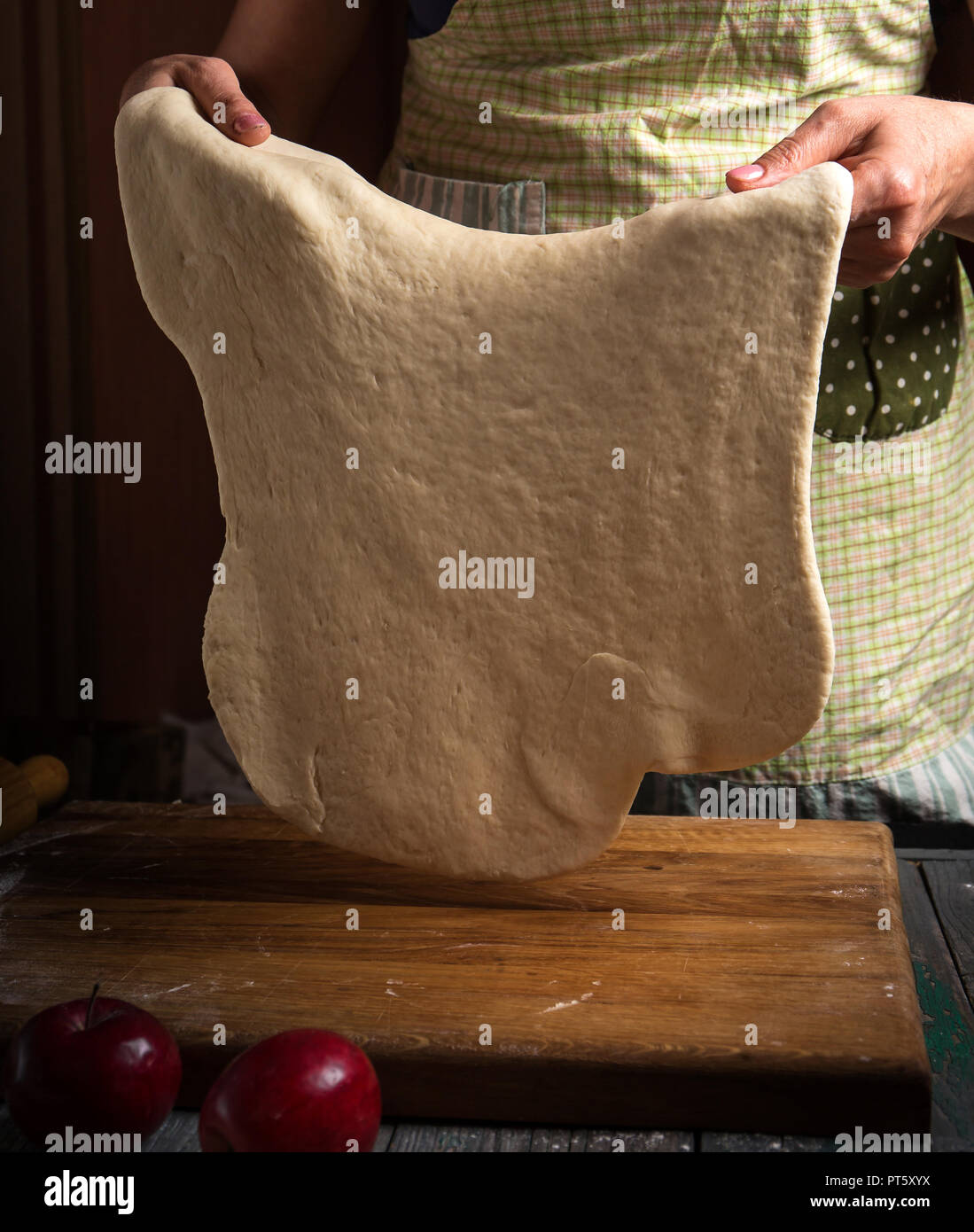 Stretching the dough for the cake Stock Photo - Alamy