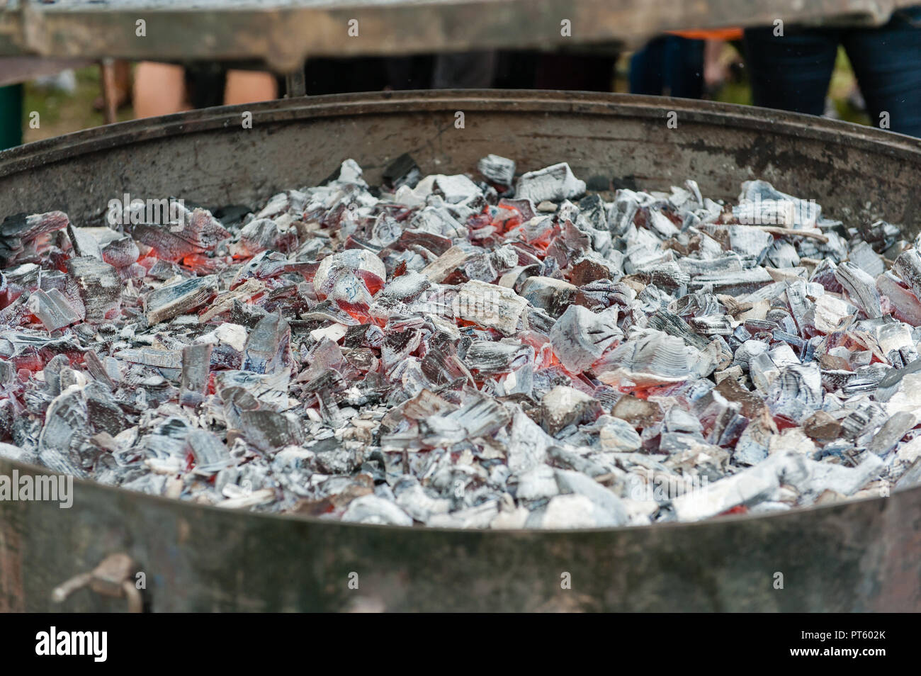 Round metal charcoal grill for barbeque ready Stock Photo - Alamy