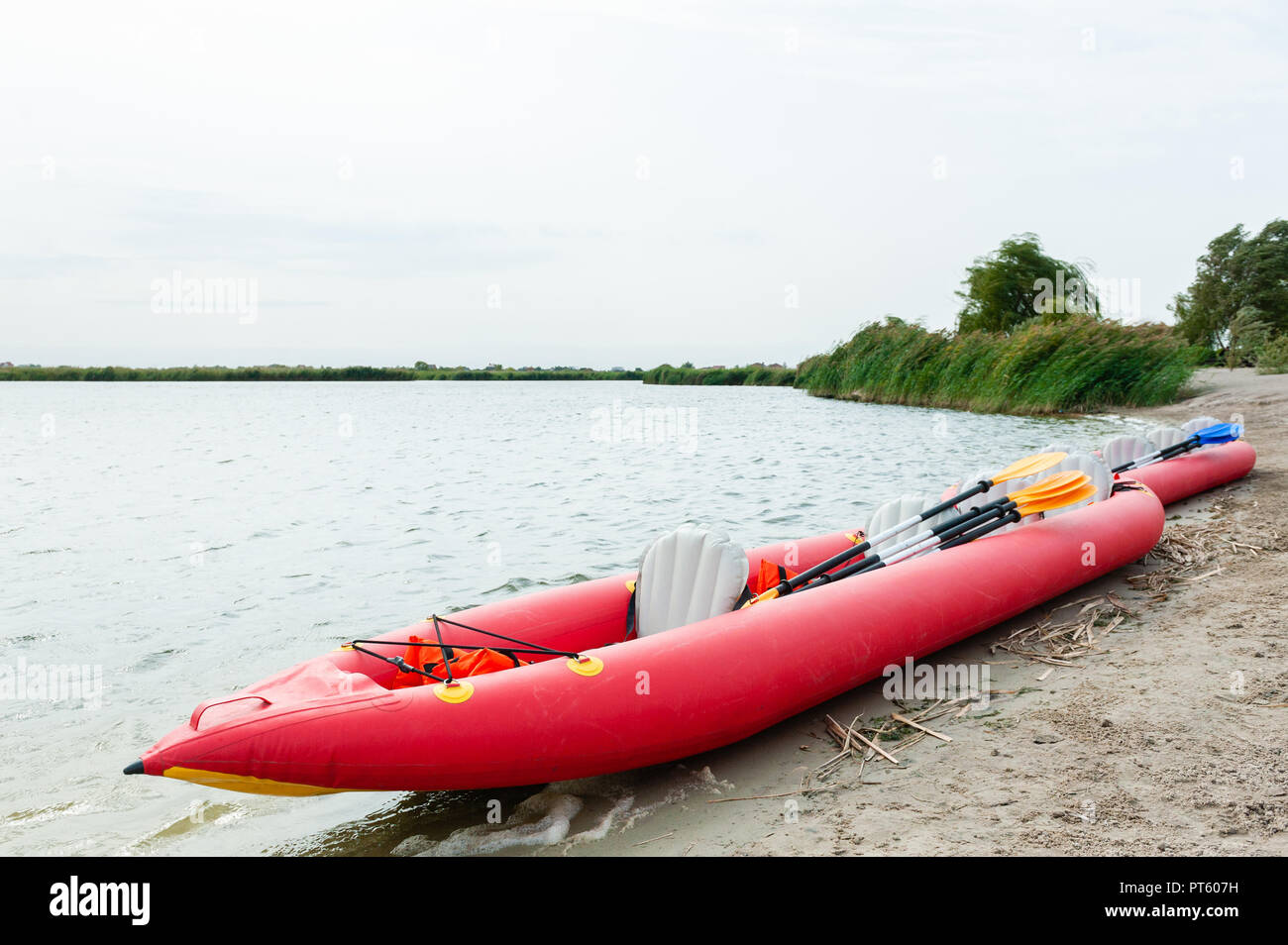 Inflatable red boat kayak at the beach Stock Photo - Alamy