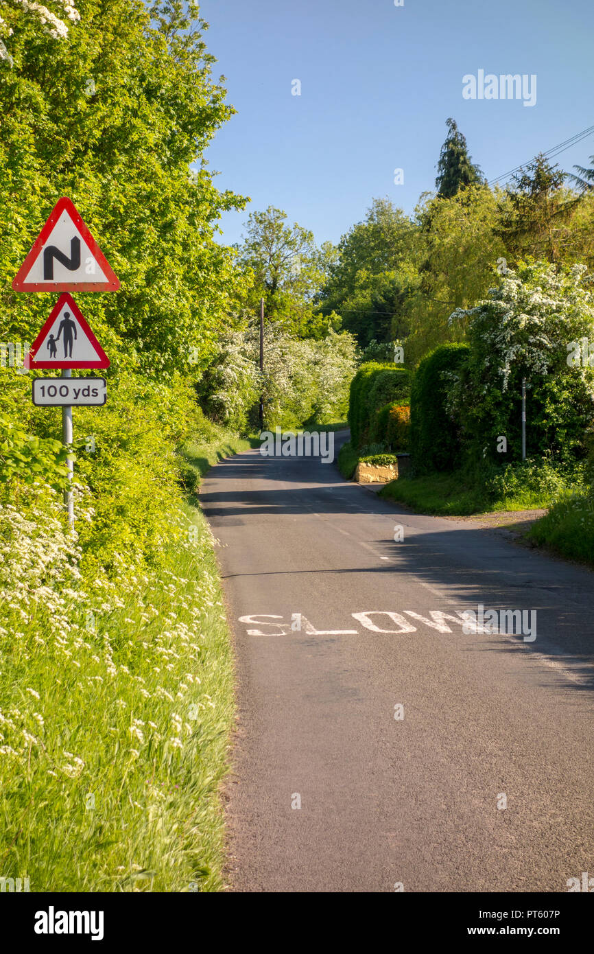 Warning triangle road signs for bends and pedestrians with slow sign on ...